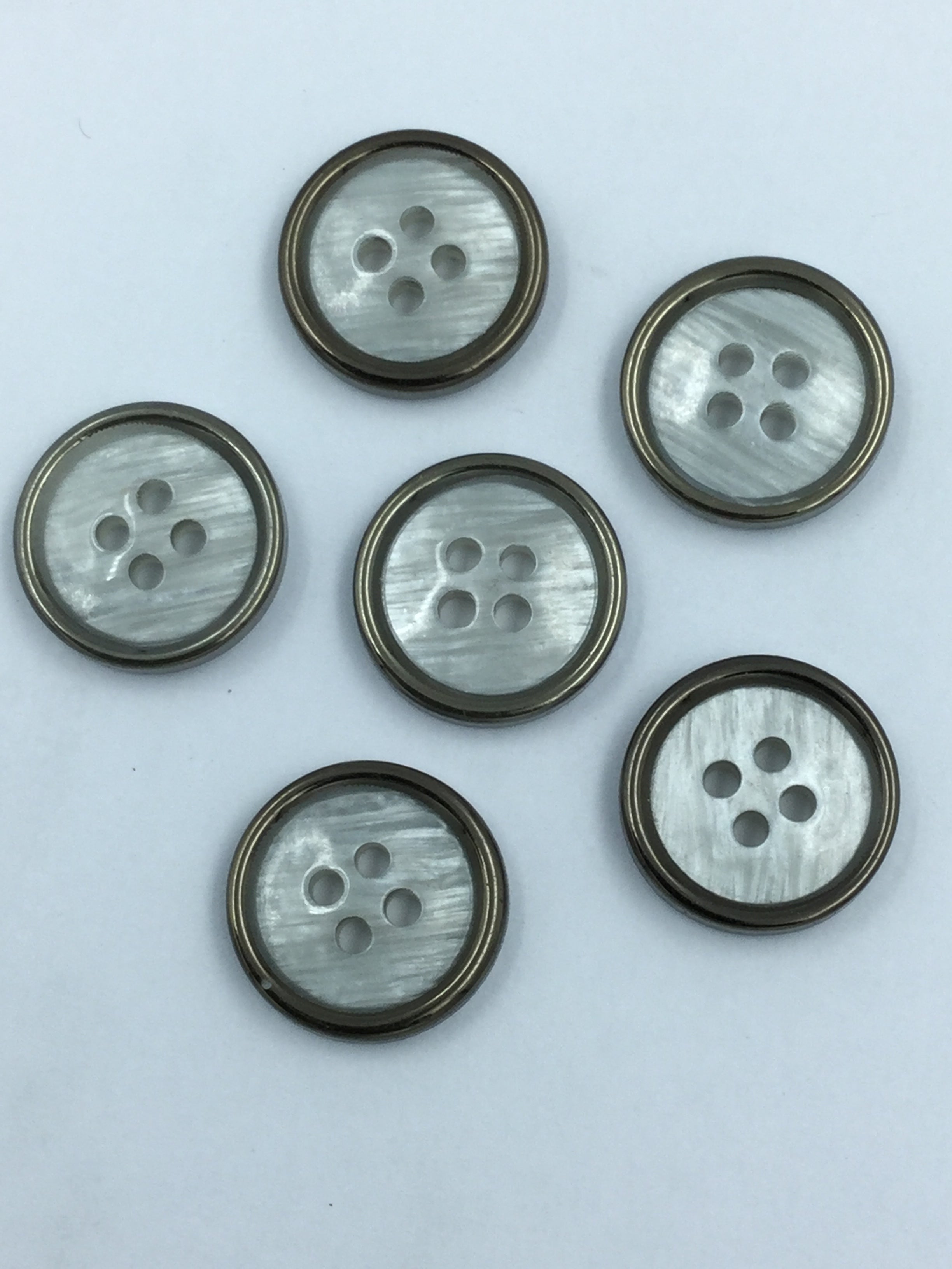 White Circular Plastic Shirt Buttons