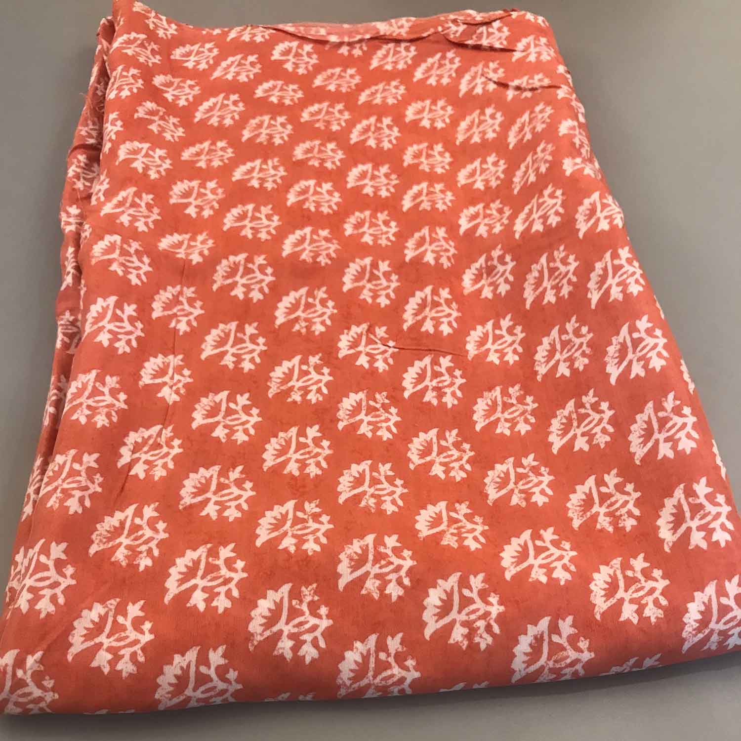 White Motif Rust Orange Viscose Muslin Fabric